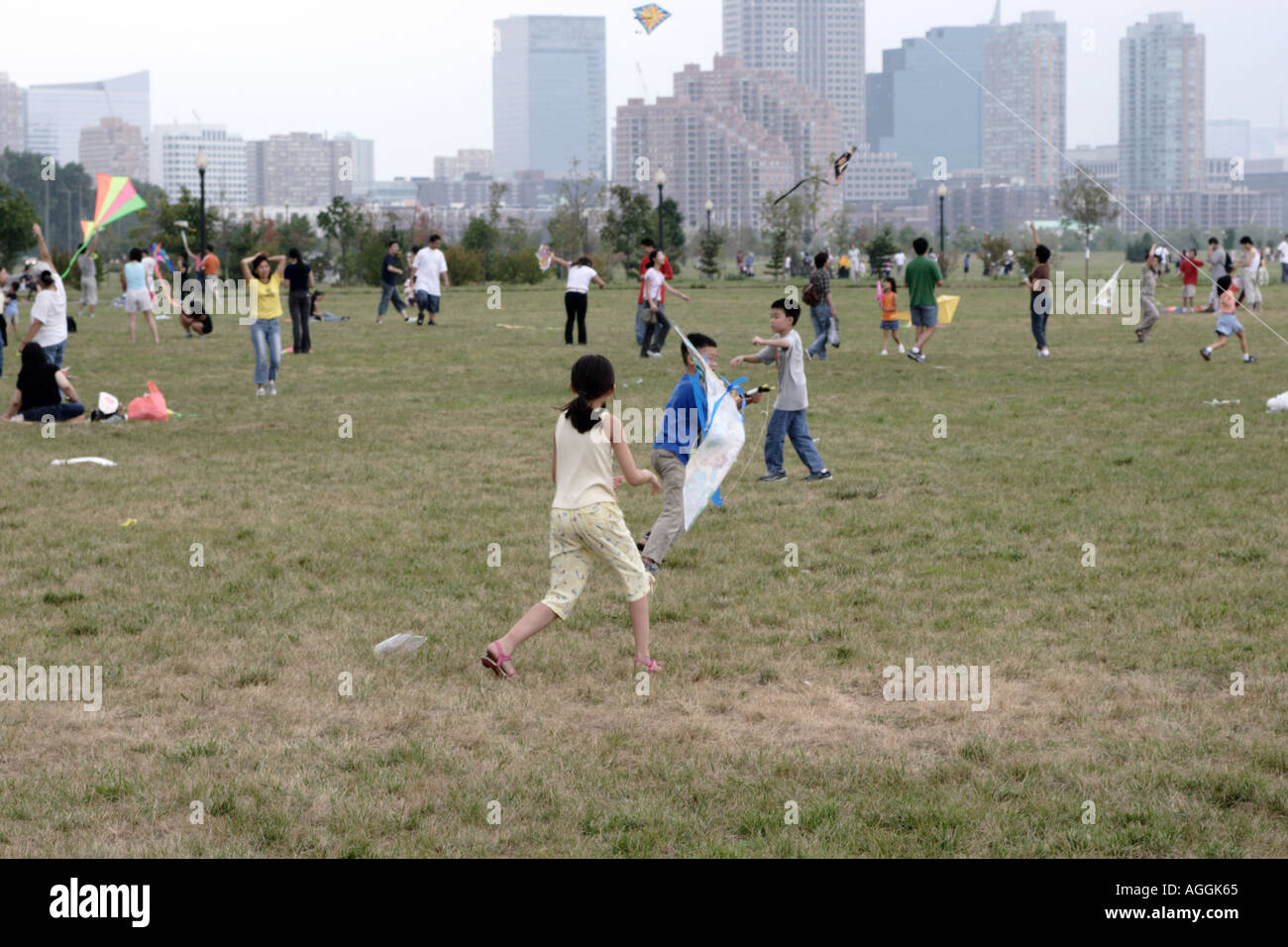 Young brother and Sister fly kite at Kite Festival in Liberty State ...