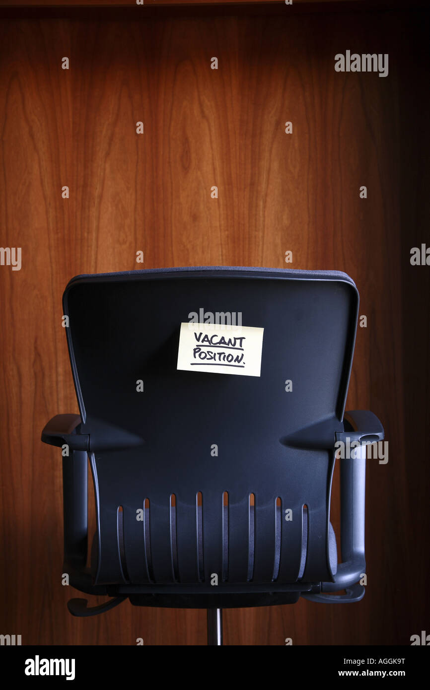 vacant position written on a post it note sticked on a armchair in an ...