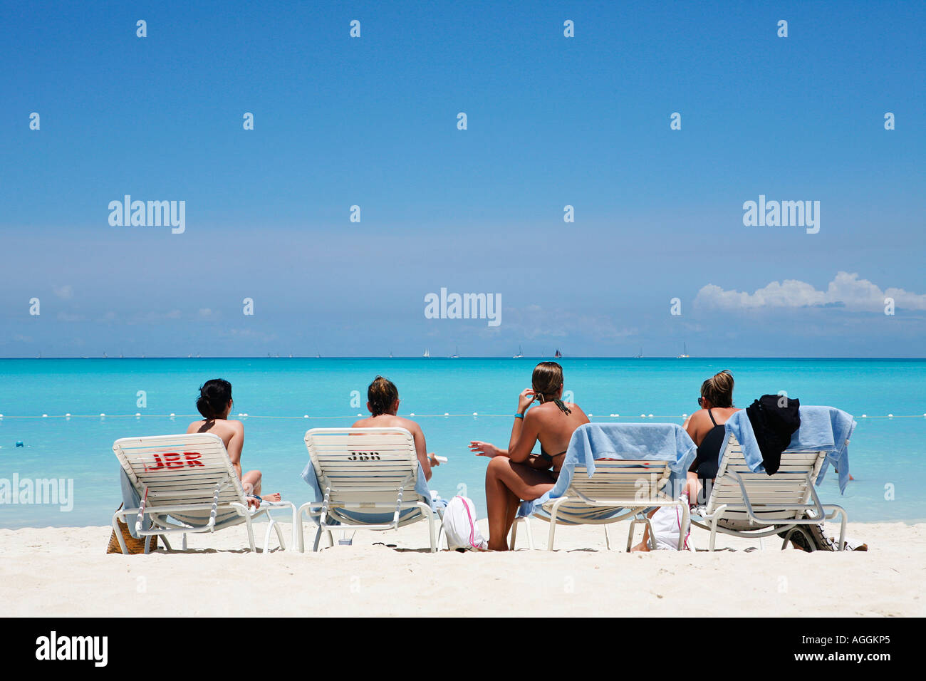 People sunbathing on beach holidays hi-res stock photography and images ...