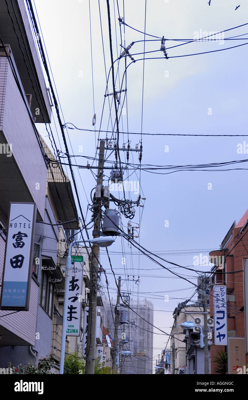 electrical wires hanging over backstreet, Tokyo, Japan Stock Photo - Alamy