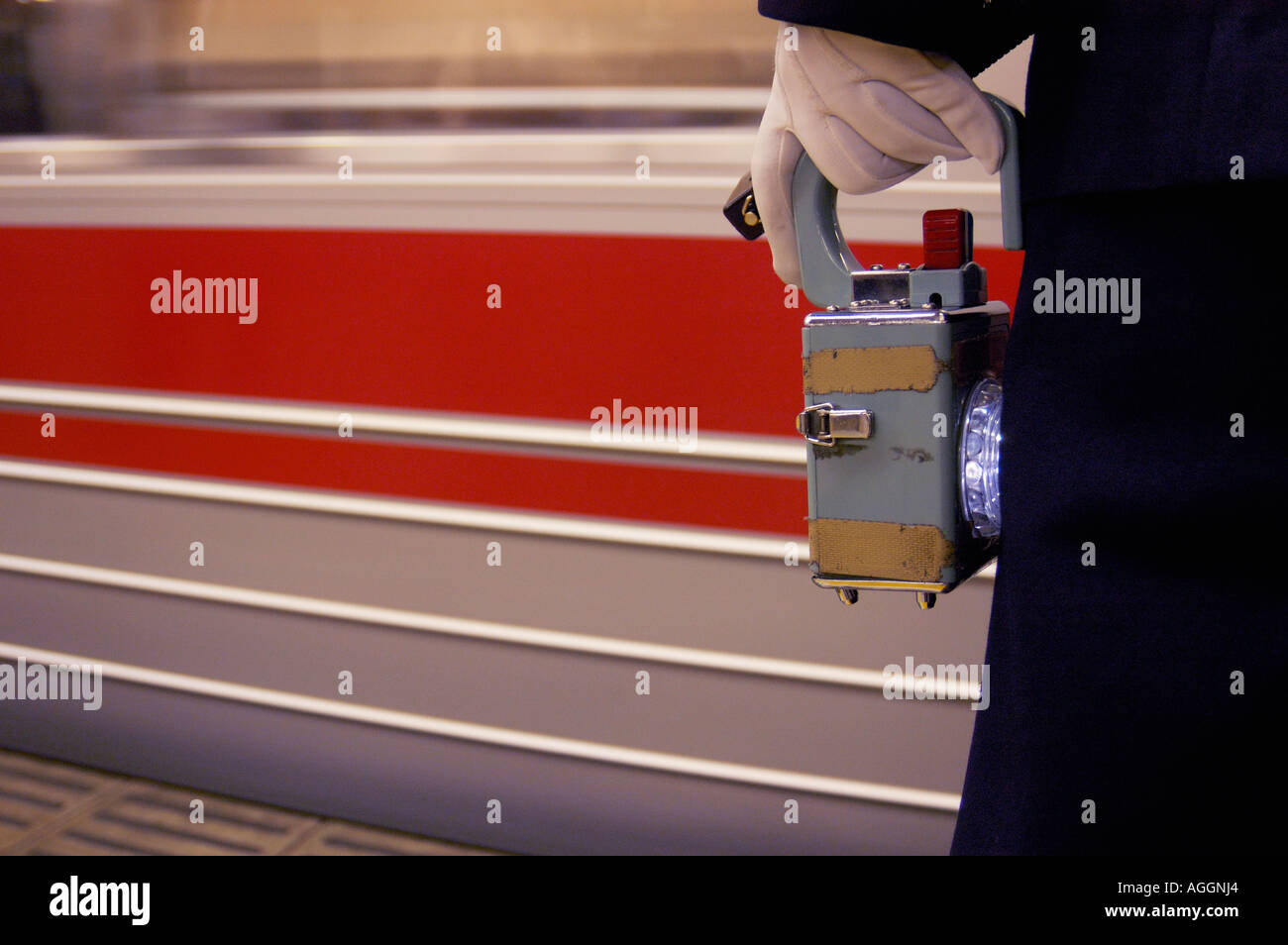 train attendant/stationmaster with signal lamp, Tokyo, Japan Stock ...