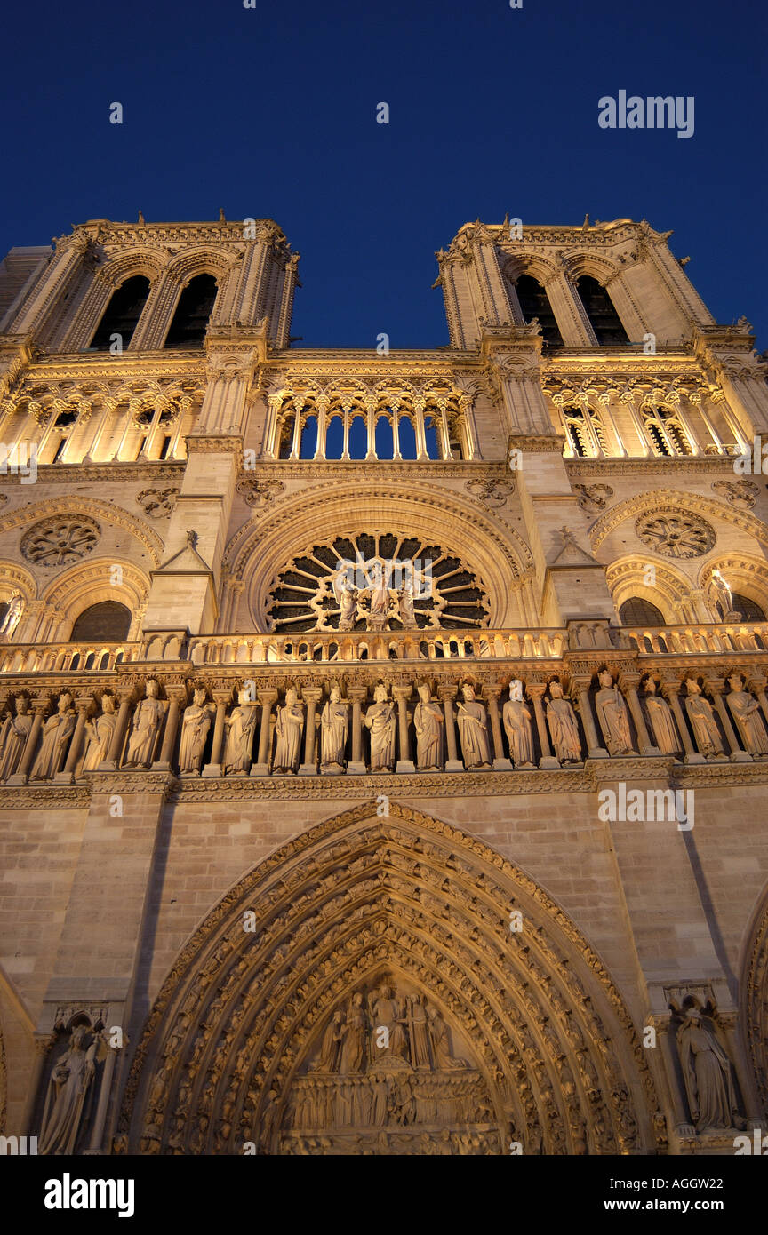 Main early gothic facade of the Notre Dame Cathedral at night Paris ...