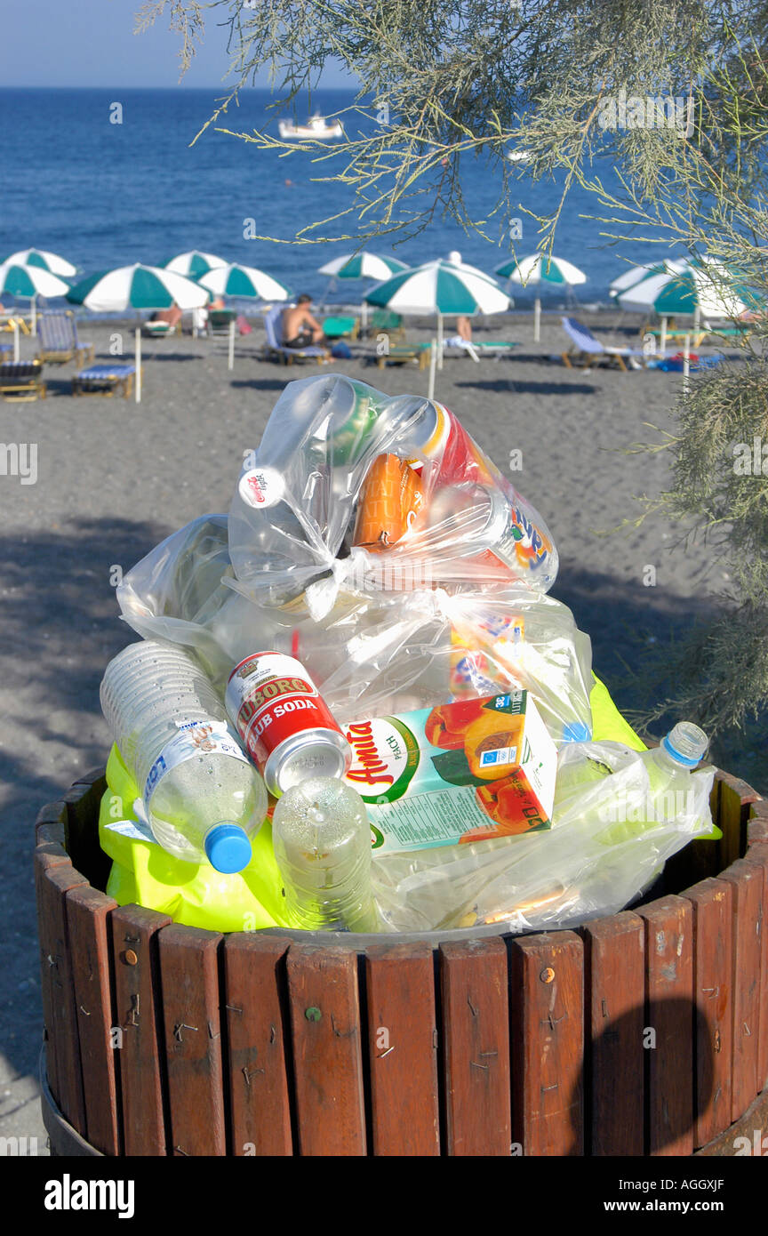 full trash can at beach resort, Santorini, Greece Stock Photo - Alamy