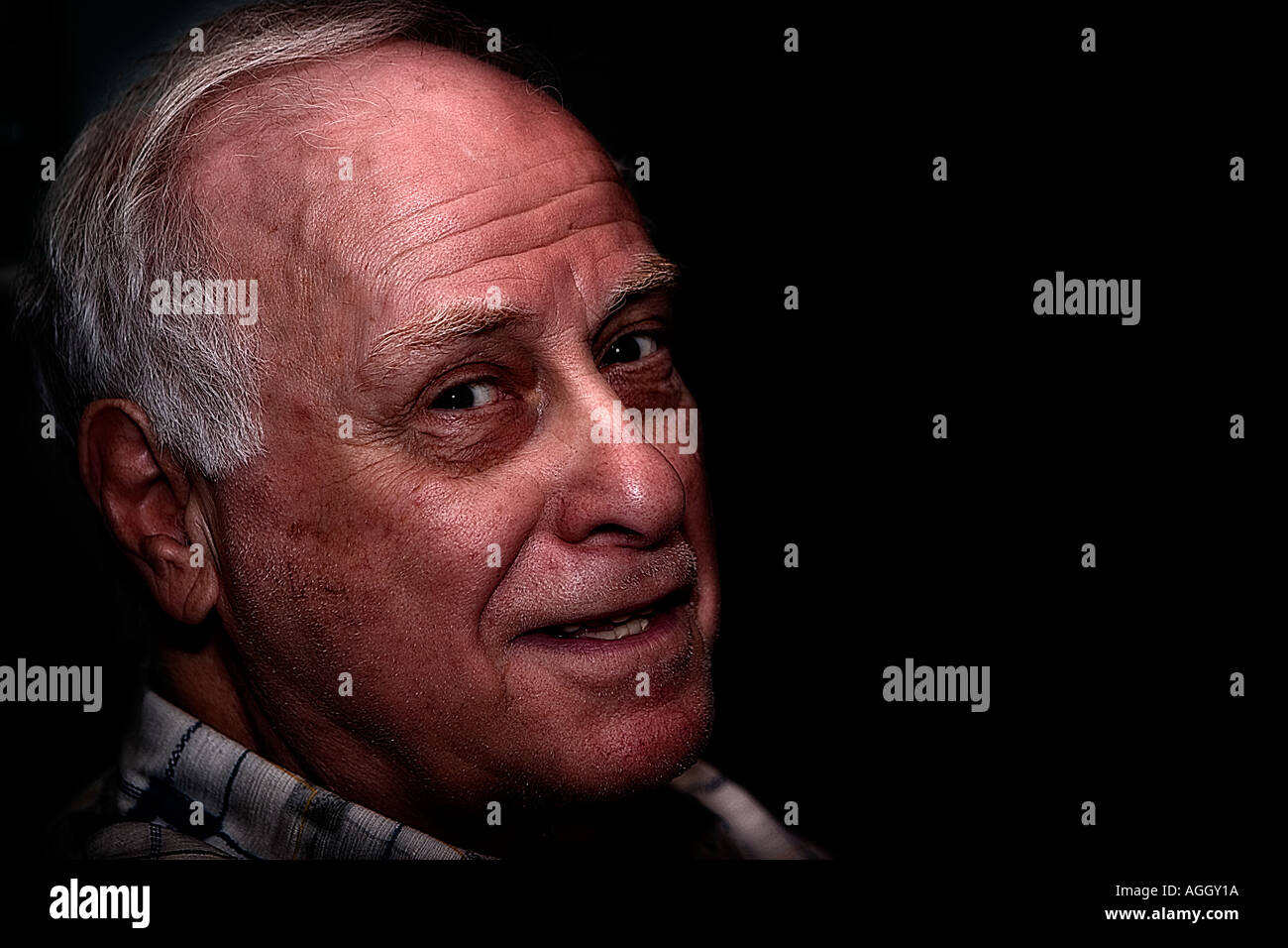 dark stylized portrait of senior citizen gentleman with dark background ...