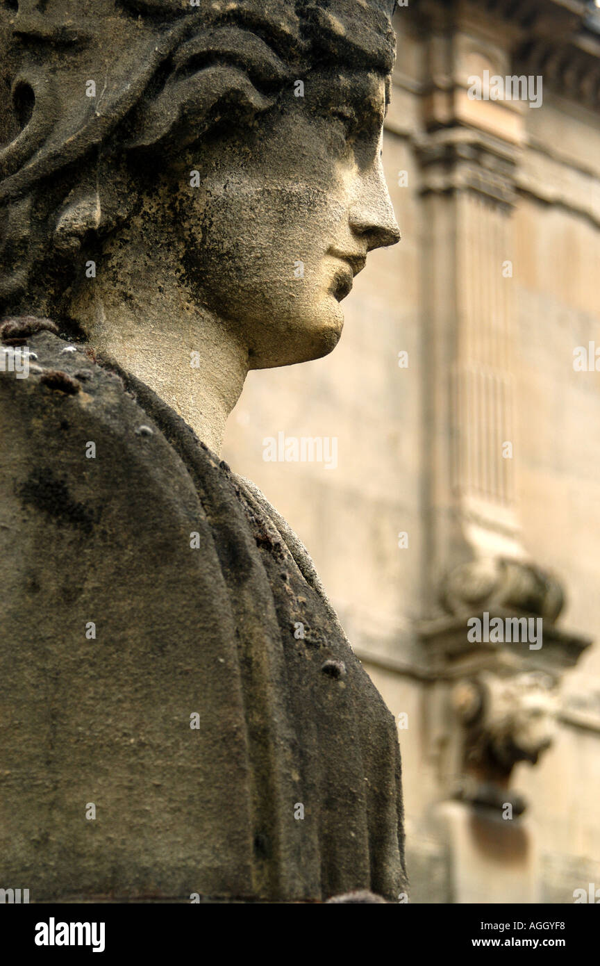 Statue at the Roman Baths with Georgian architecture in background Bath ...