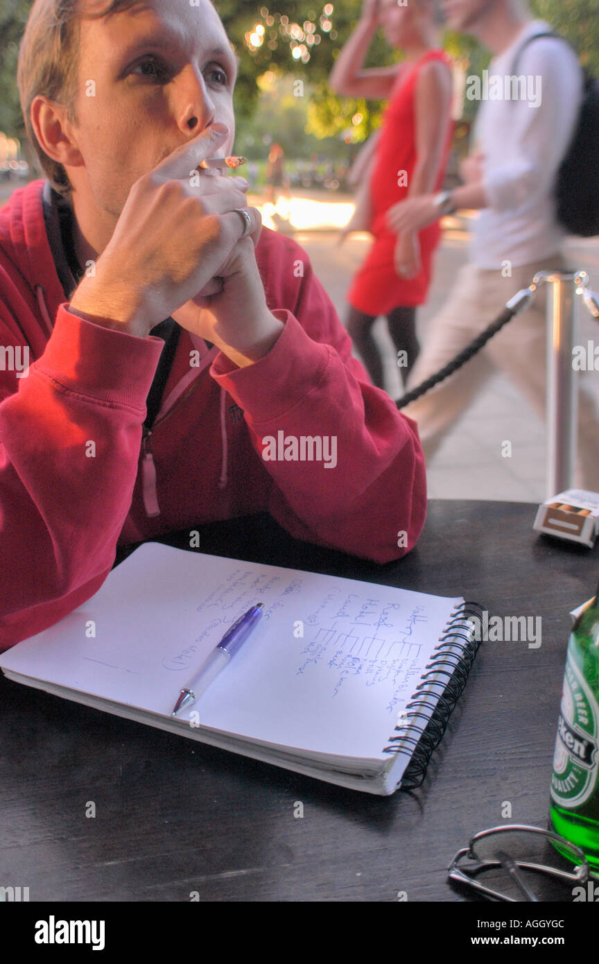 Smoking man taking notes at restaurant, Stockholm, Stockholm Stock ...