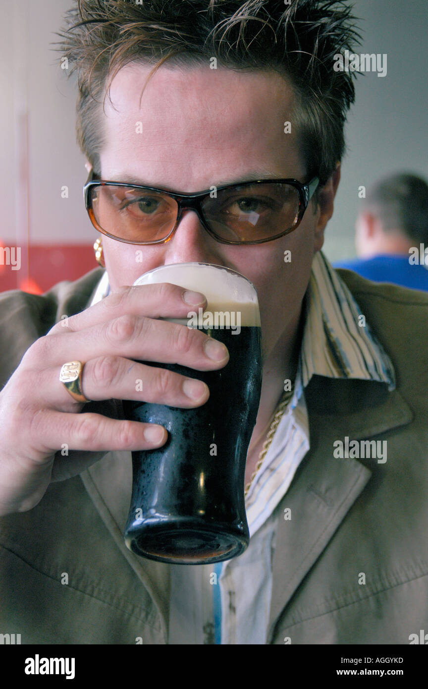 hyped man drinking beer Stock Photo - Alamy