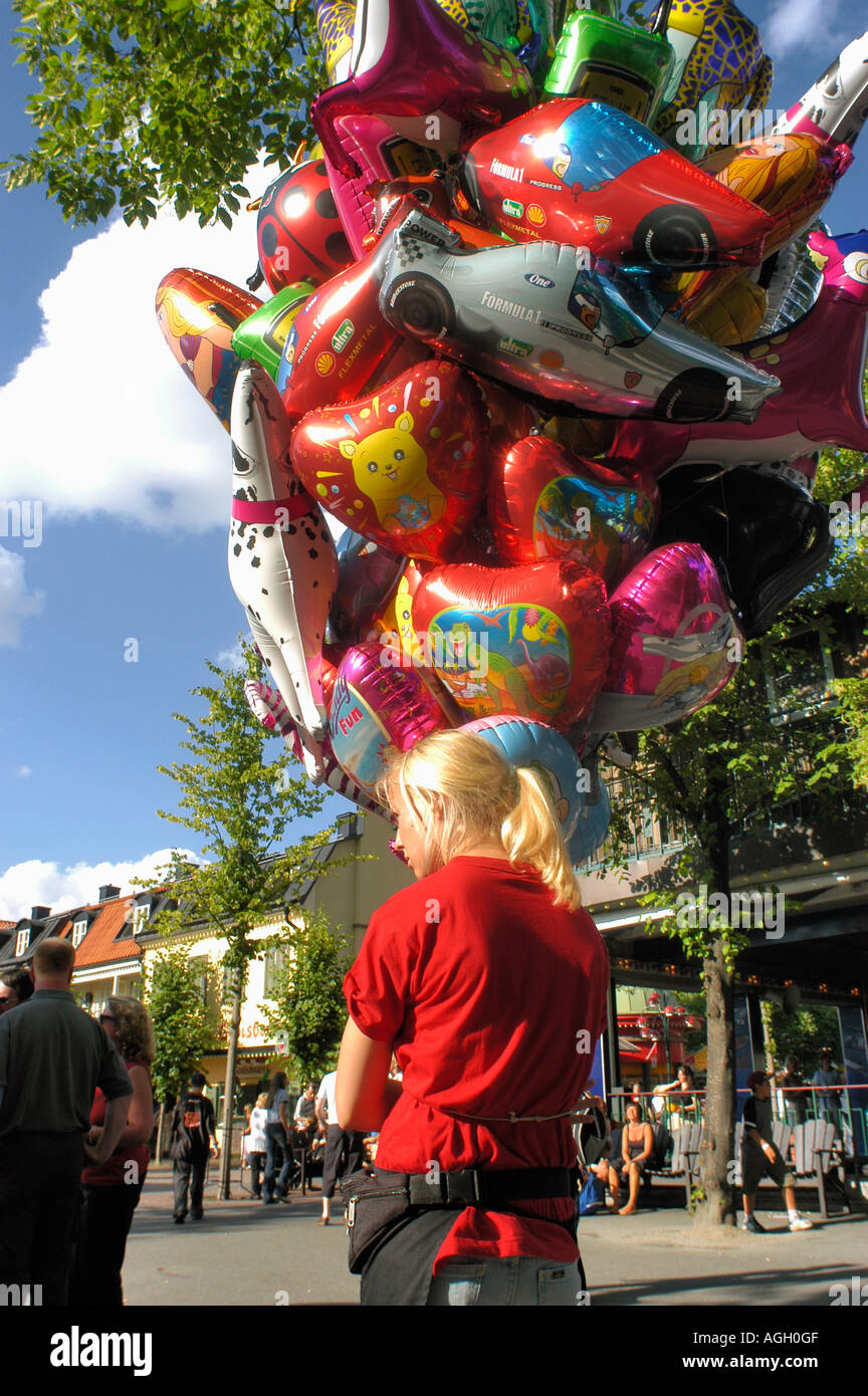 young girl selling balloons in amusement park, Sweden Stock Photo - Alamy