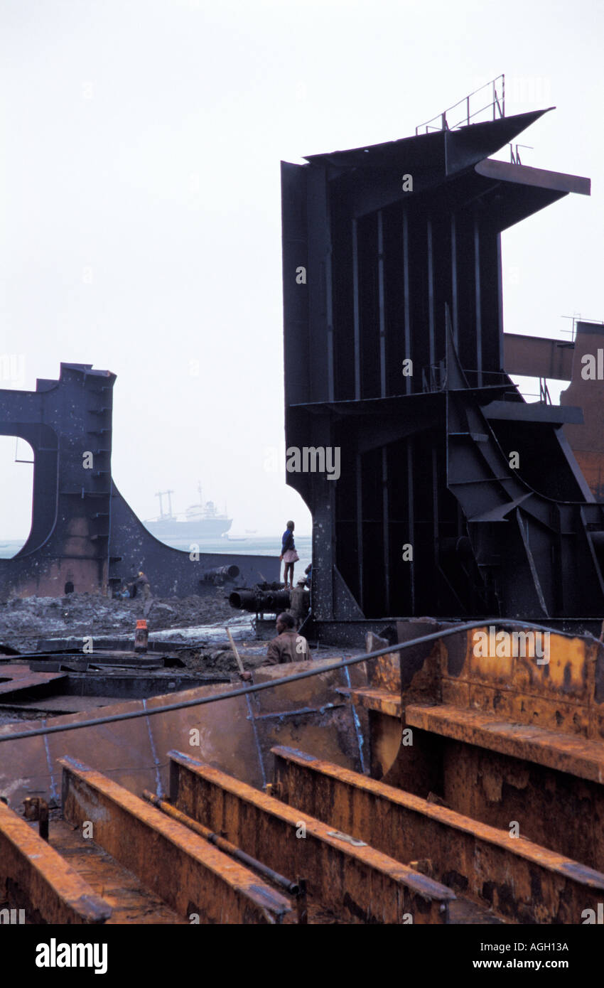 Bangladesh ship breaking yard (Chittagong). Ship recycling yard with industrial workers, heavy ...