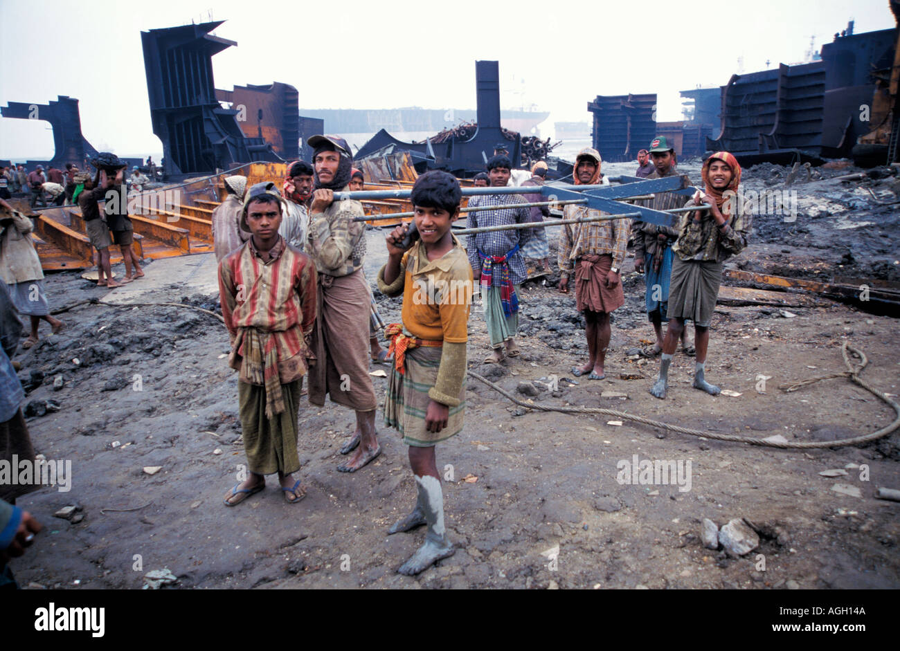 Bangladesh ship breaking yard (Chittagong). Ship recycling yard with industrial workers, heavy ...