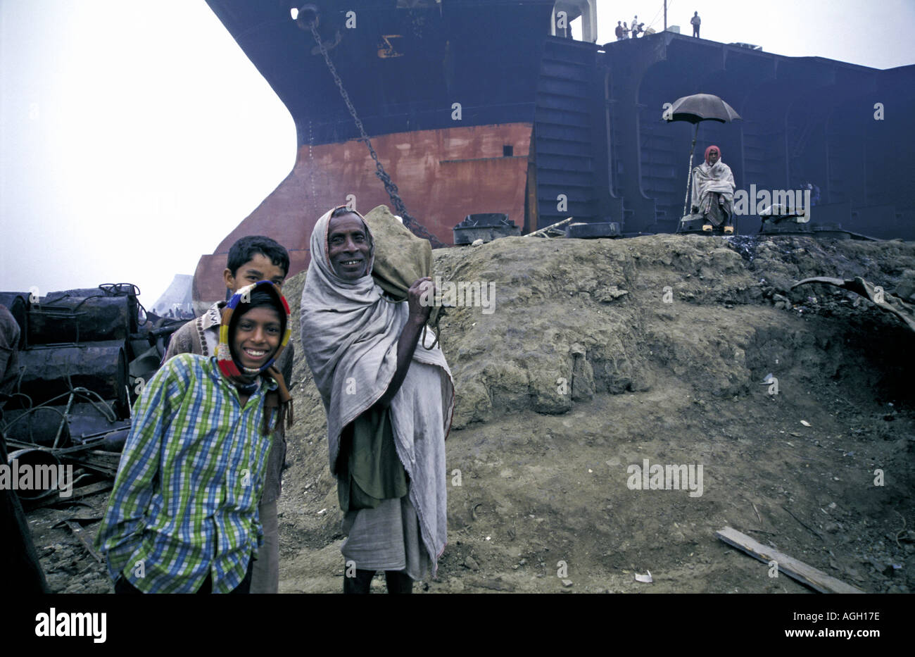 Bangladesh ship breaking yard (Chittagong). Ship recycling yard with industrial workers, heavy ...