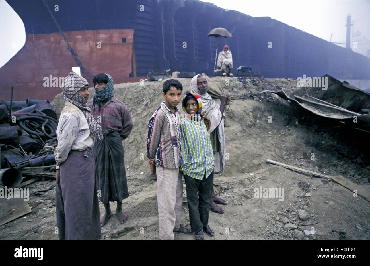 Bangladesh ship breaking yard (Chittagong). Ship recycling yard with industrial workers, heavy ...