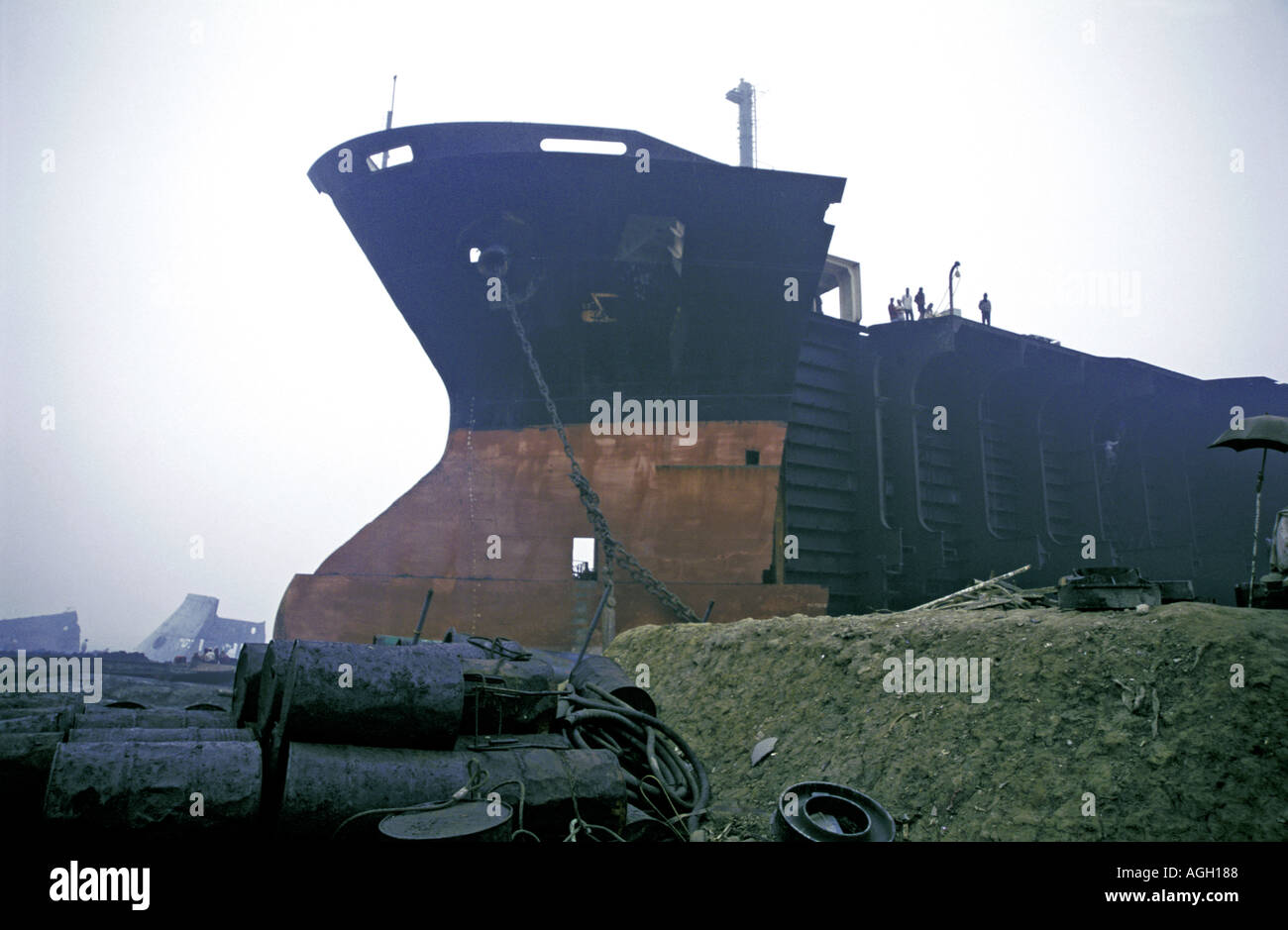 Bangladesh ship breaking yard (Chittagong). Ship recycling yard with industrial workers, heavy ...
