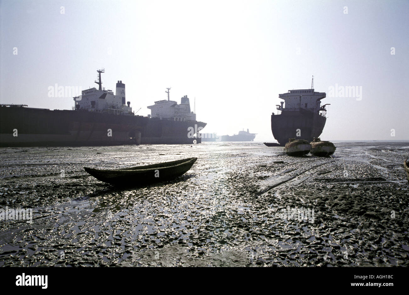 Bangladesh ship breaking yard (Chittagong). Ship recycling yard with industrial workers, heavy ...
