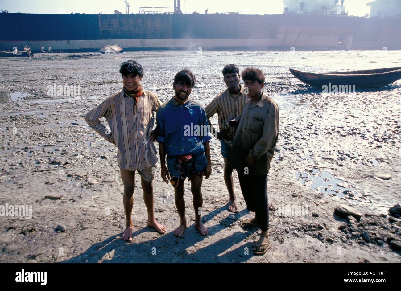 Bangladesh ship breaking yard (Chittagong). Ship recycling yard with industrial workers, heavy ...