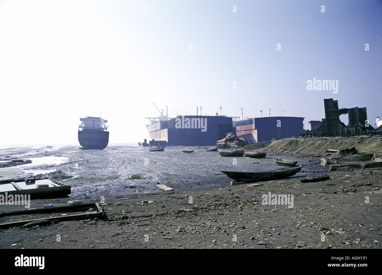 Bangladesh ship breaking yard (Chittagong). Ship recycling yard with industrial workers, heavy ...