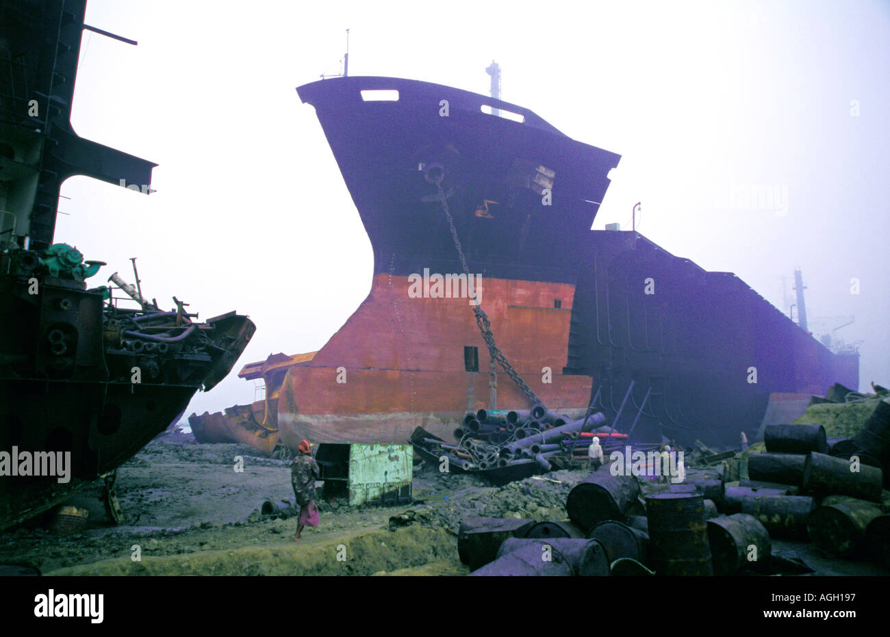 Bangladesh ship breaking yard (Chittagong). Ship recycling yard with industrial workers, heavy ...