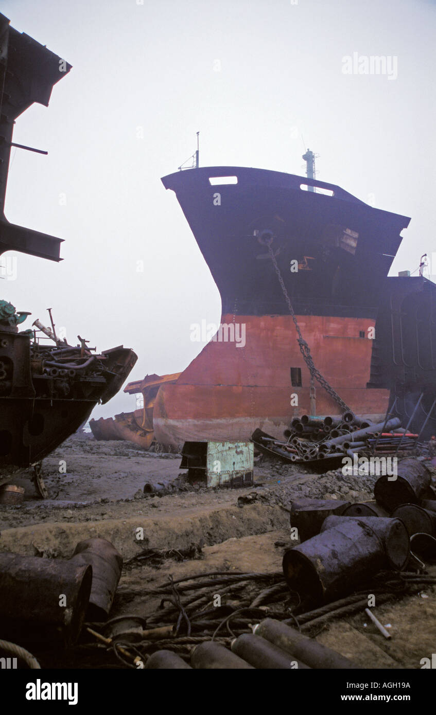 Bangladesh ship breaking yard (Chittagong). Ship recycling yard with industrial workers, heavy ...