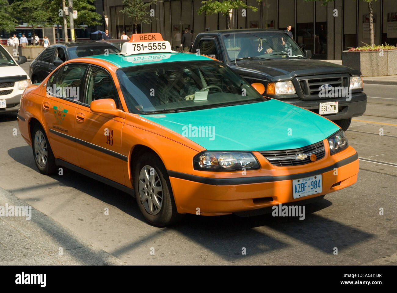 A green and orange Toronto taxi Stock Photo - Alamy
