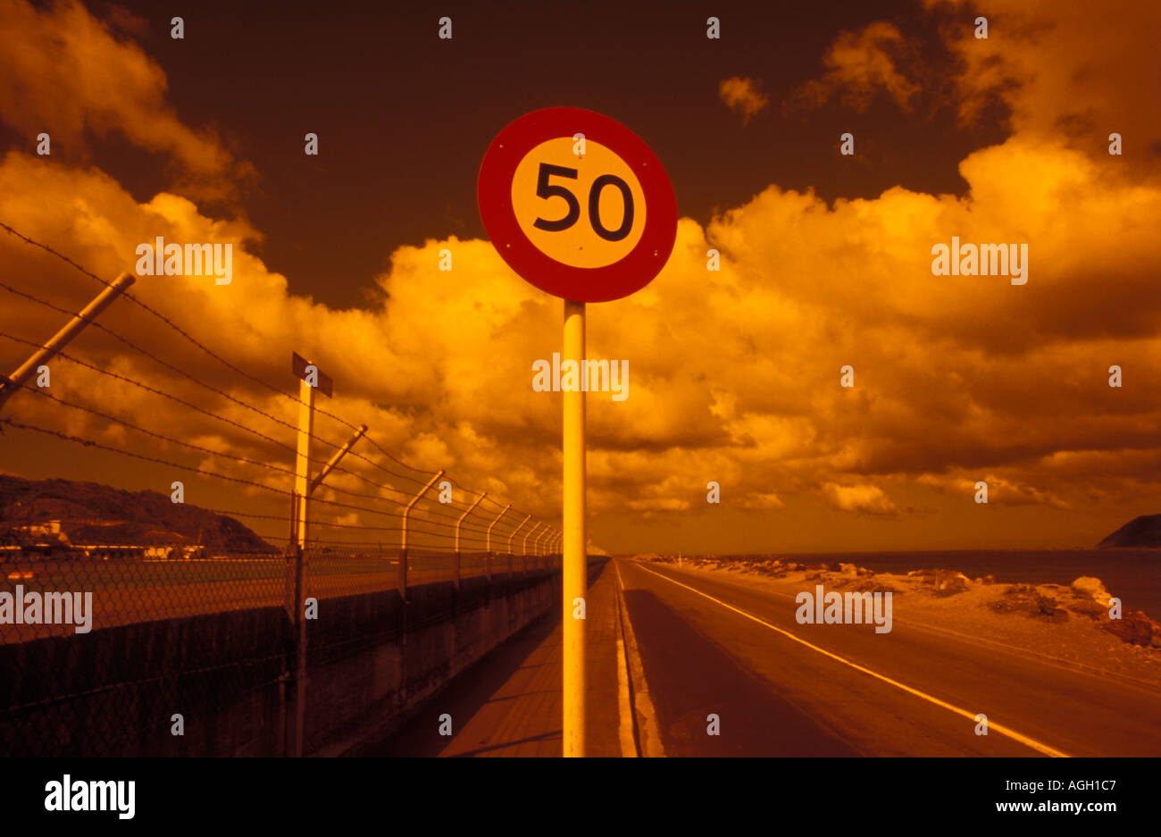 New Zealand 50 speed sign and road signage with dramatic cloud ...