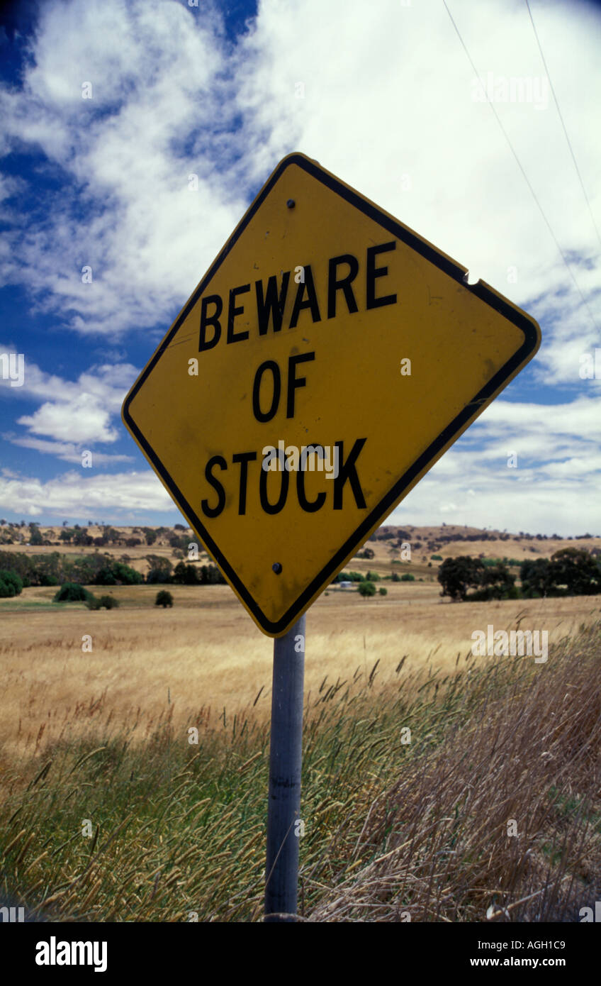 Australian beware of stock warning road sign. Black typeface lettering ...