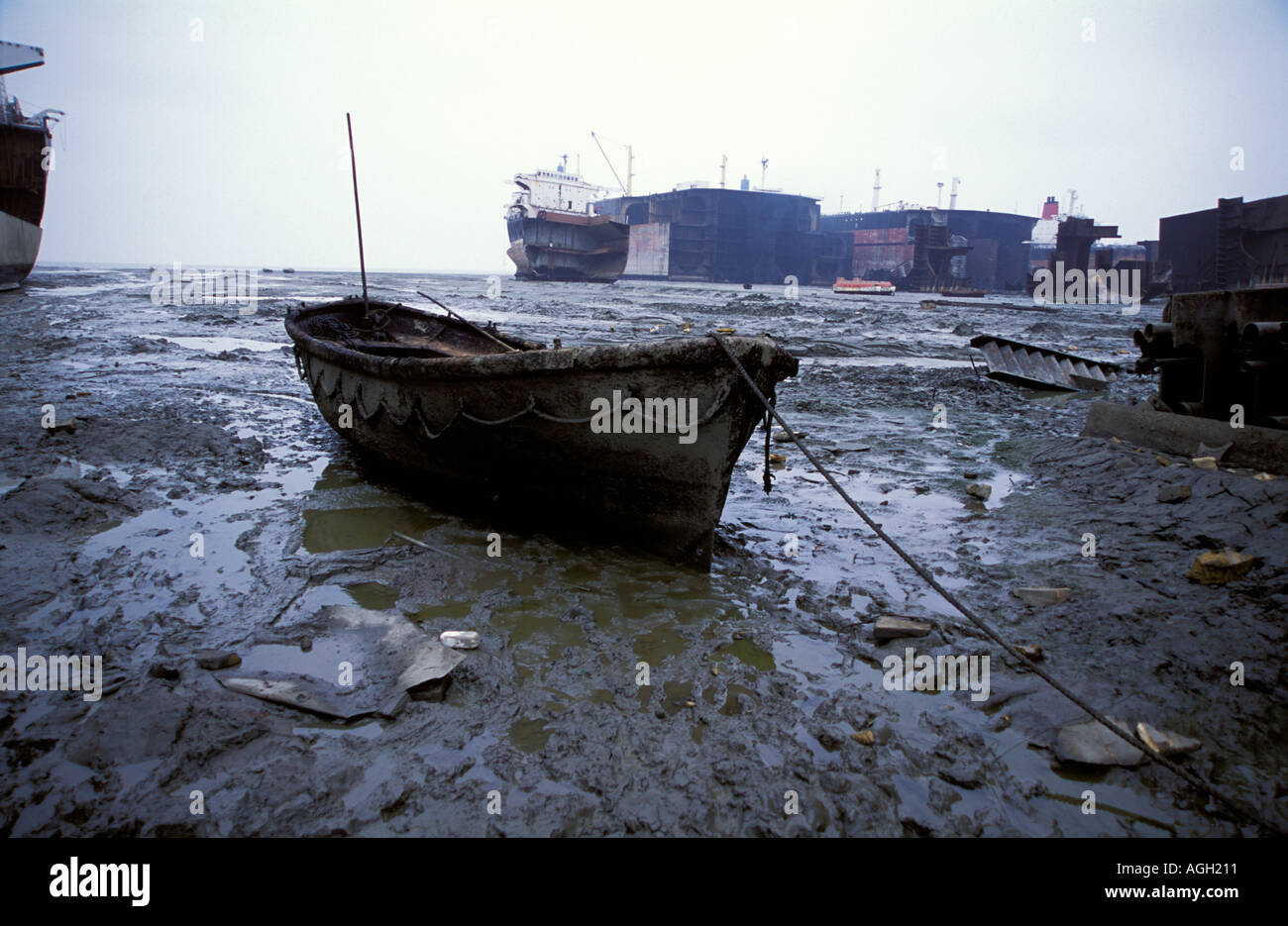 Bangladesh ship breaking yard (Chittagong). Ship recycling yard with industrial workers, heavy ...
