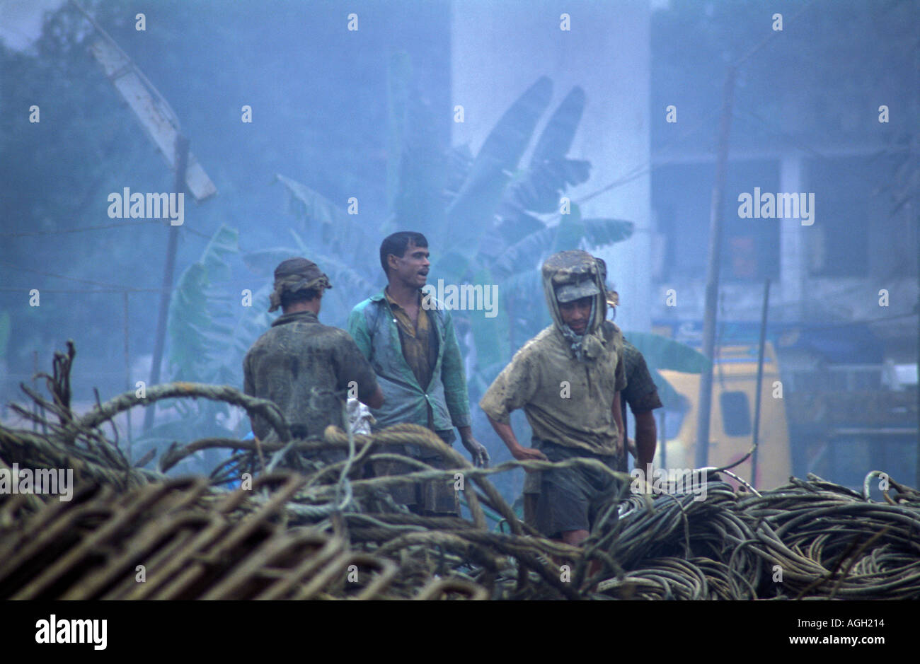 Bangladesh ship breaking yard (Chittagong). Ship recycling yard with industrial workers, heavy ...