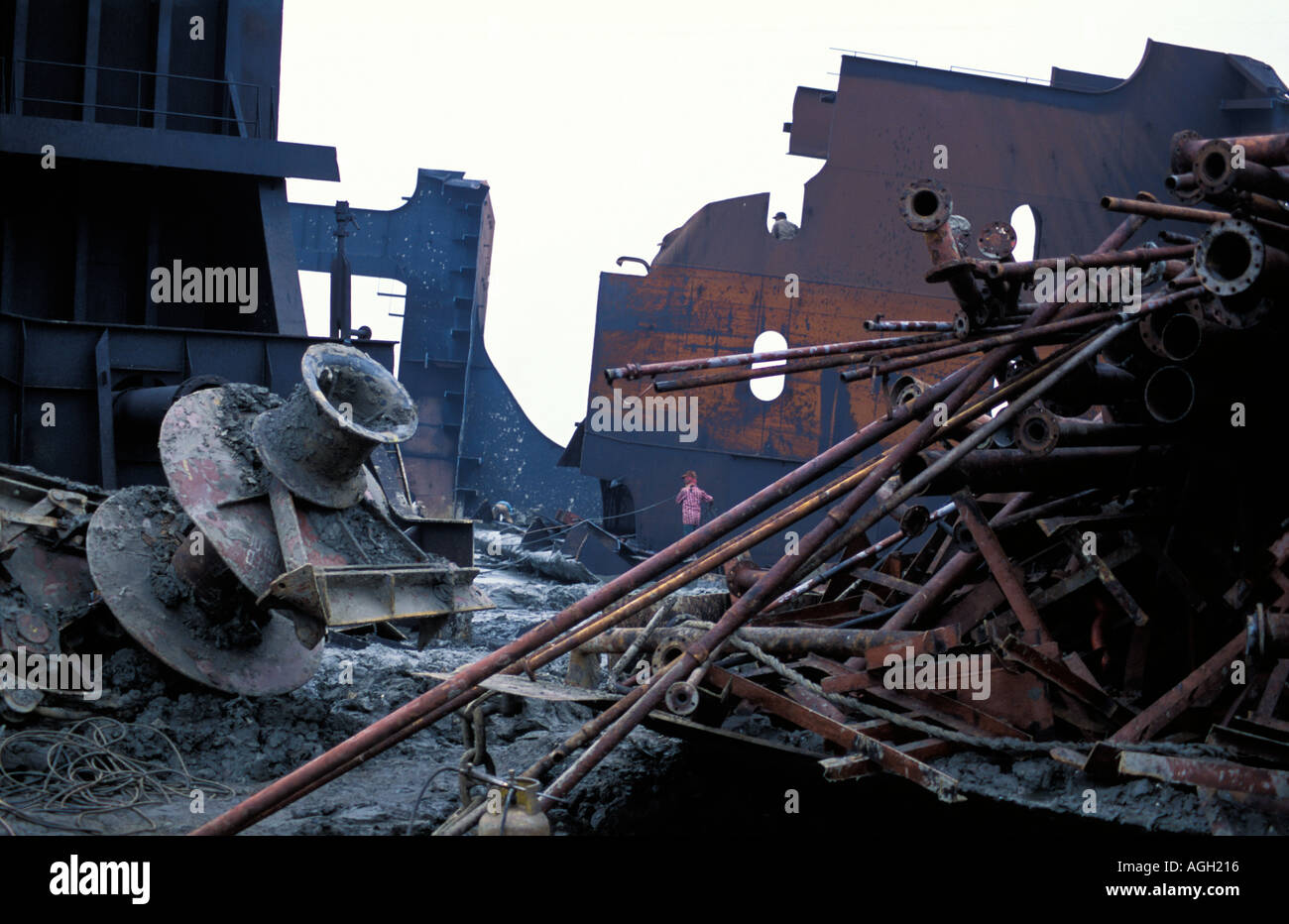 Bangladesh ship breaking yard (Chittagong). Ship recycling yard with industrial workers, heavy ...