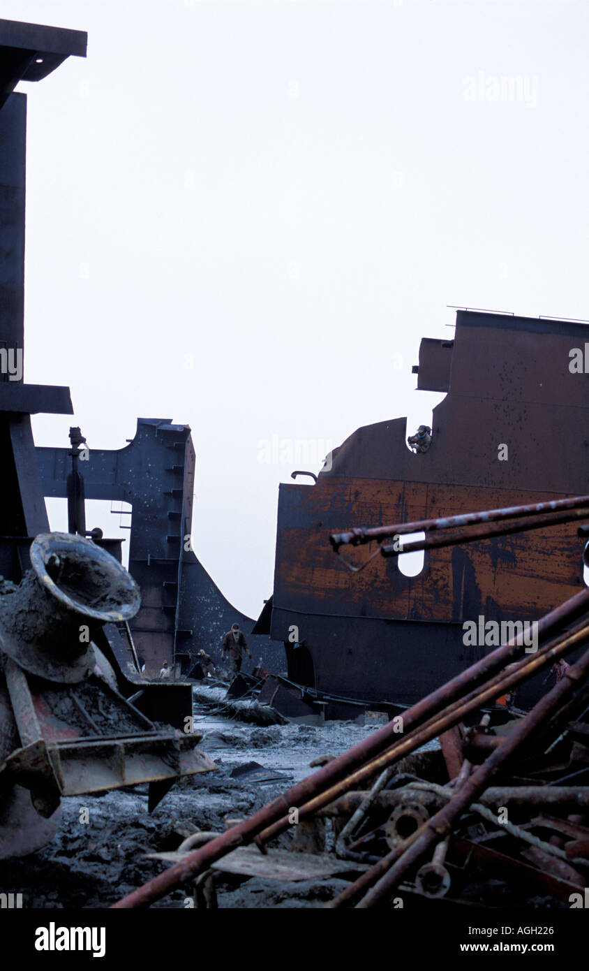Bangladesh ship breaking yard (Chittagong). Ship recycling yard with industrial workers, heavy ...