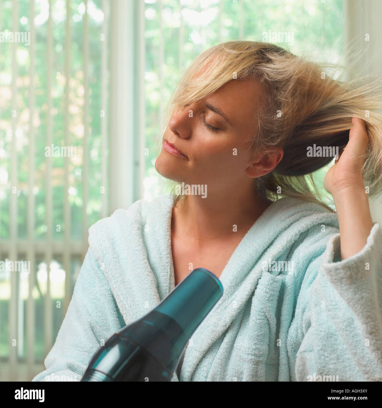 Women enjoying drying hair Stock Photo - Alamy
