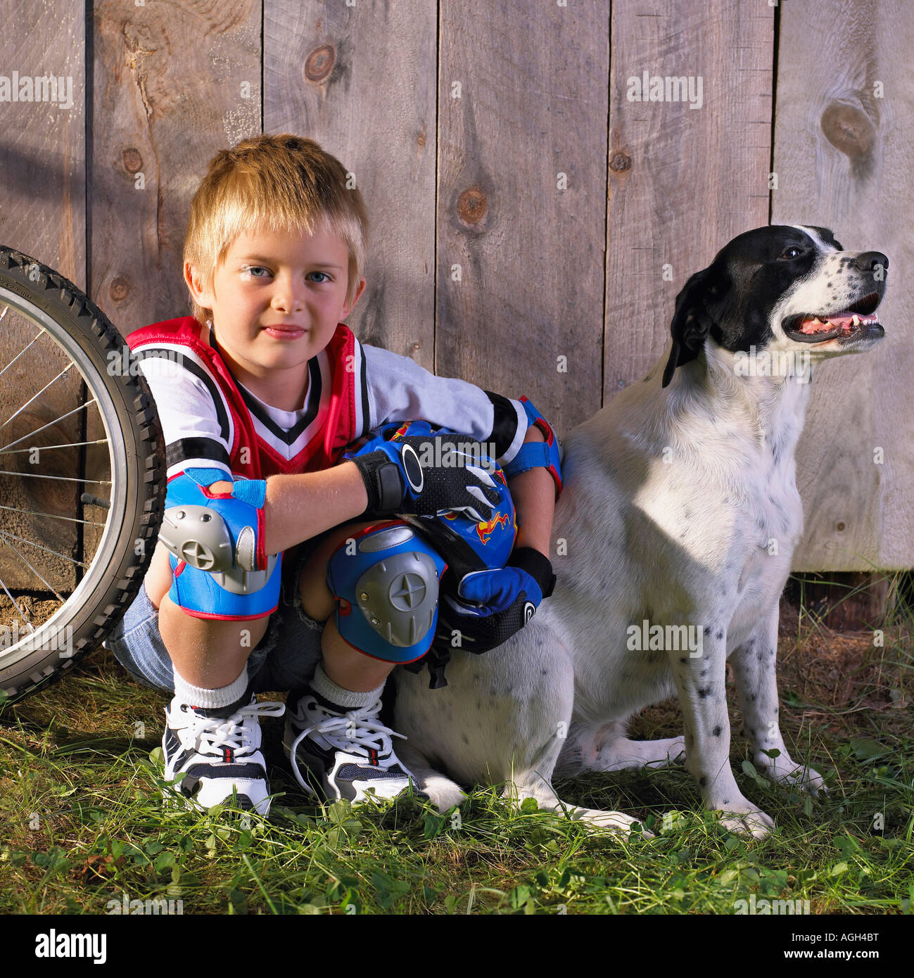 boy with dog beside bicycle Stock Photo - Alamy