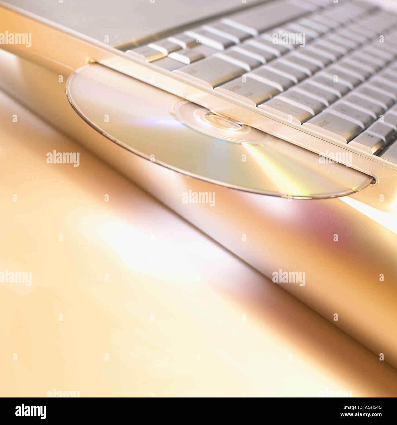 Close up image of laptop and disc in the slot Stock Photo - Alamy