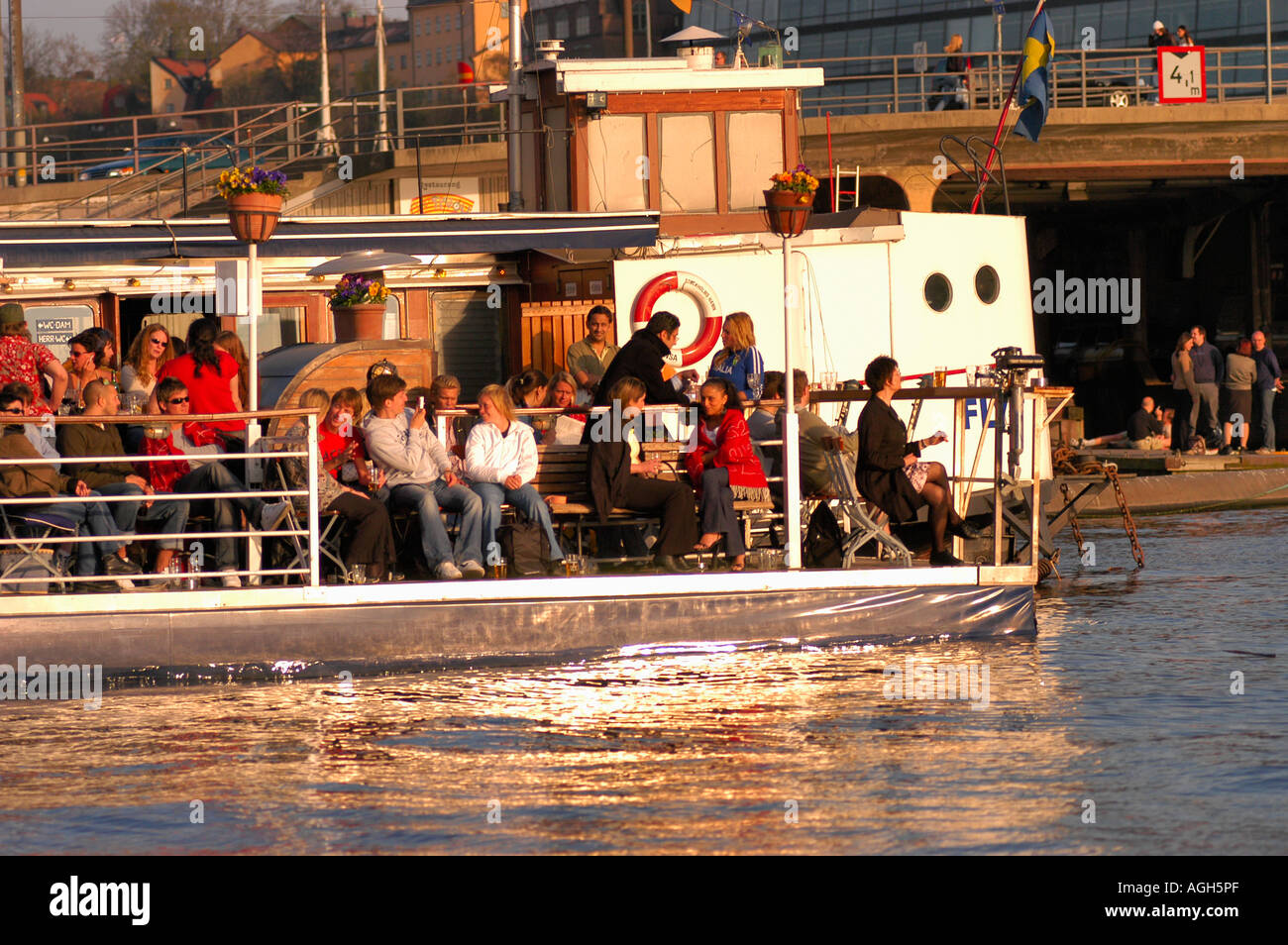 tourists on a popular floating restaurant, Slussen, Stockholm, Sweden ...