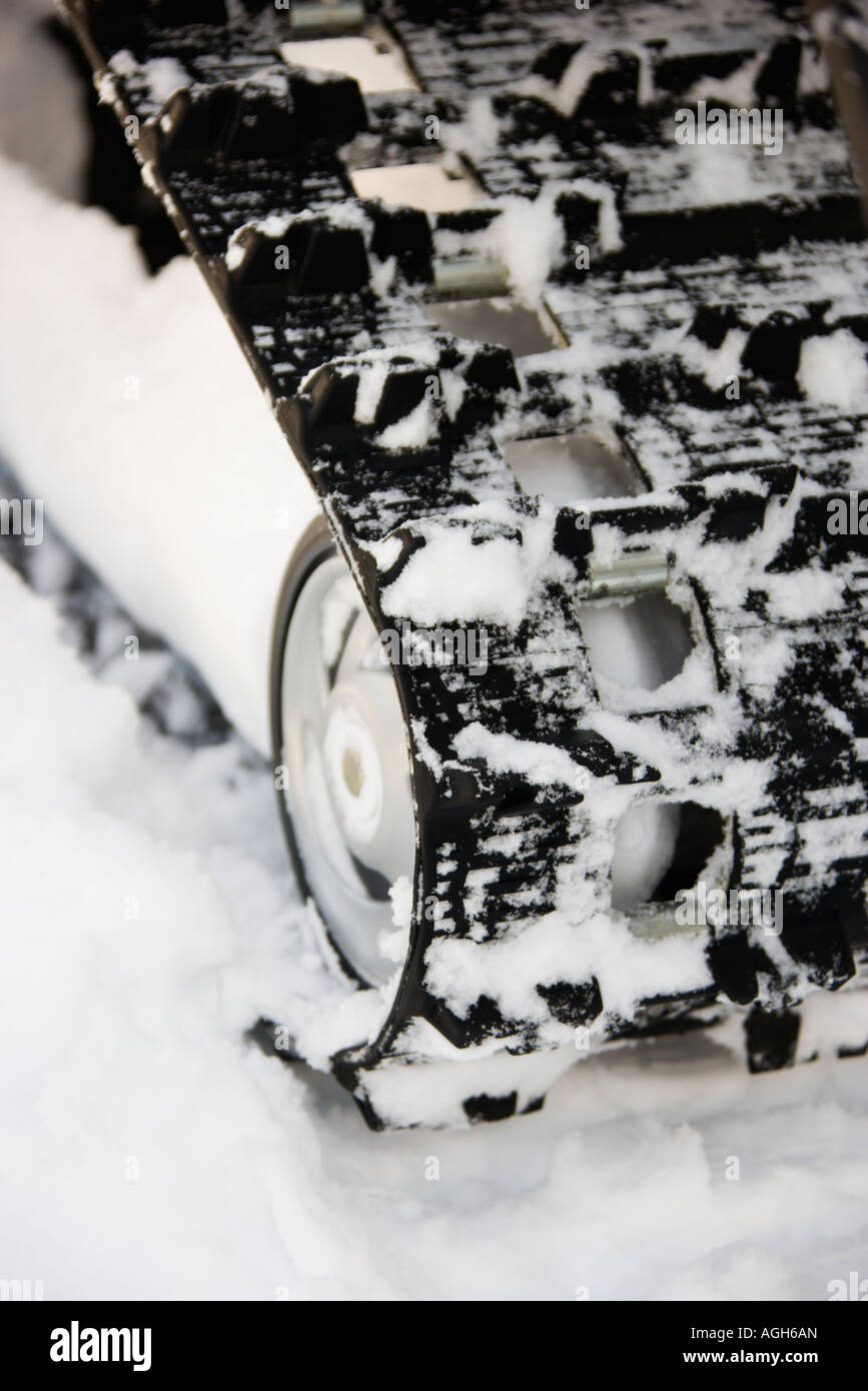 Snowmobile rubber track in snow Stock Photo - Alamy