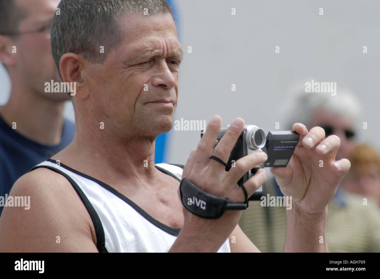 man viewing his pictures taken on JVC digital camera Stock Photo - Alamy