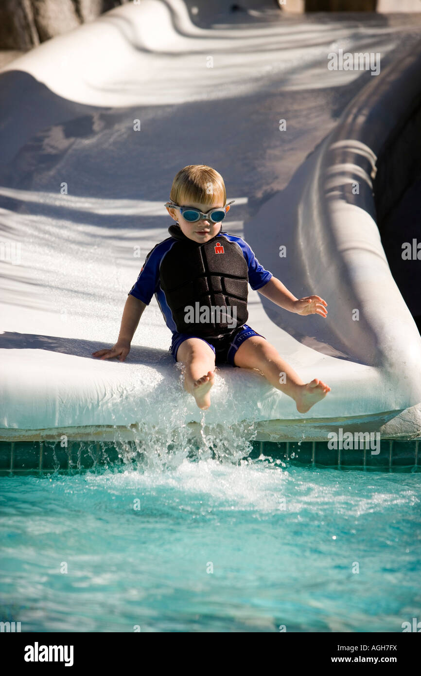 Boy sliding on water slide hi-res stock photography and images - Alamy