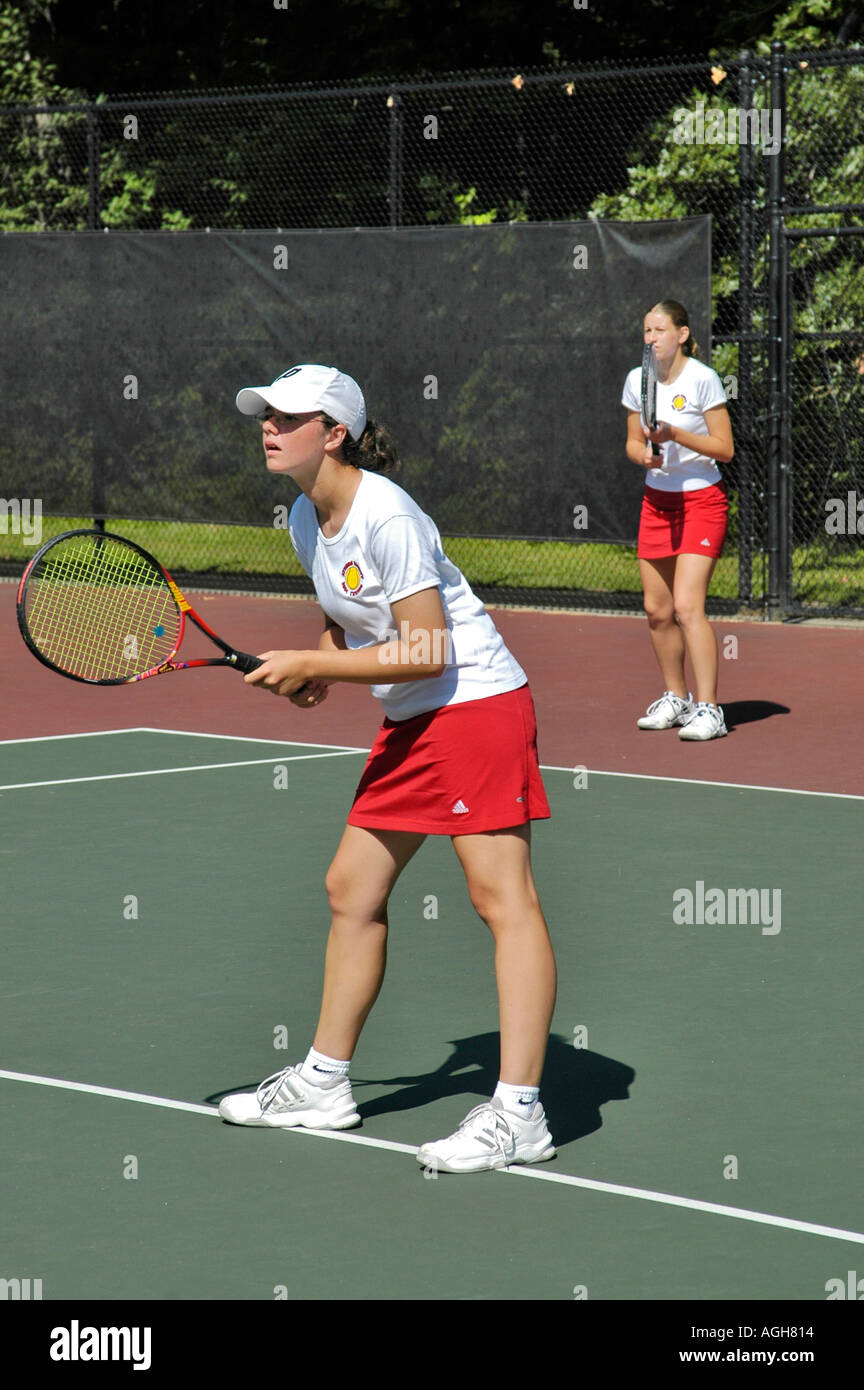 Female high school tennis action Stock Photo - Alamy