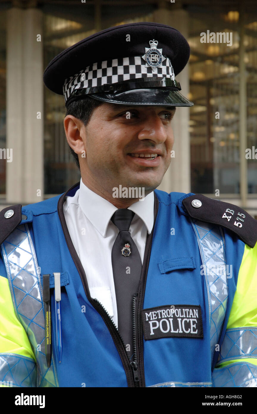 Asian Police Officer on duty London Stock Photo - Alamy