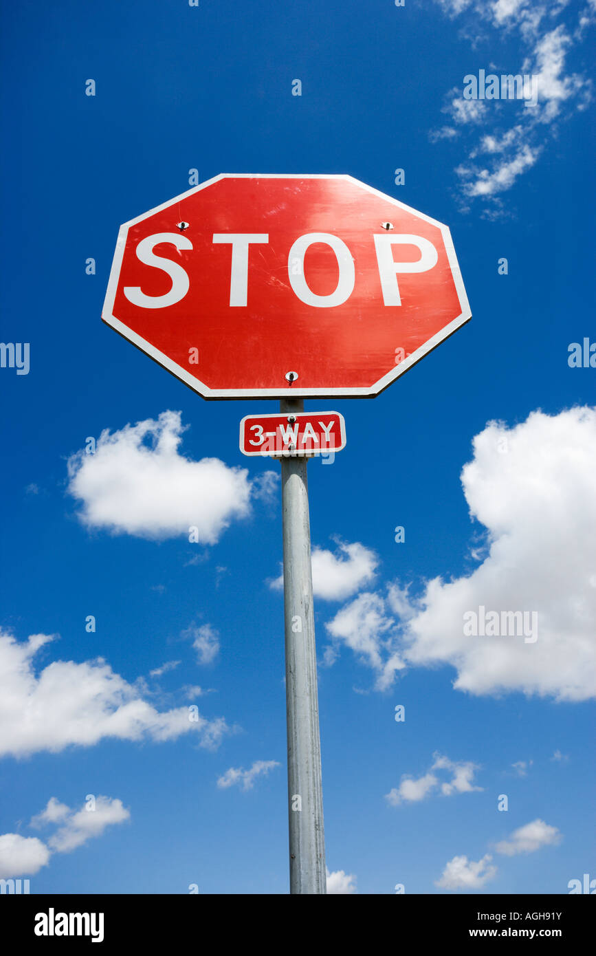 Stop sign with blue cloudy sky Stock Photo - Alamy