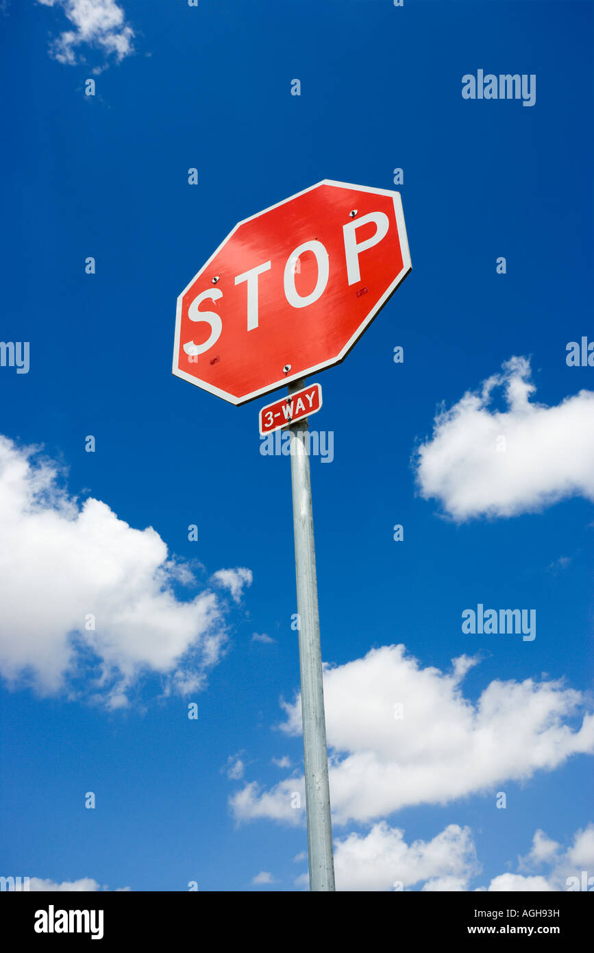 Stop sign with blue cloudy sky Stock Photo - Alamy