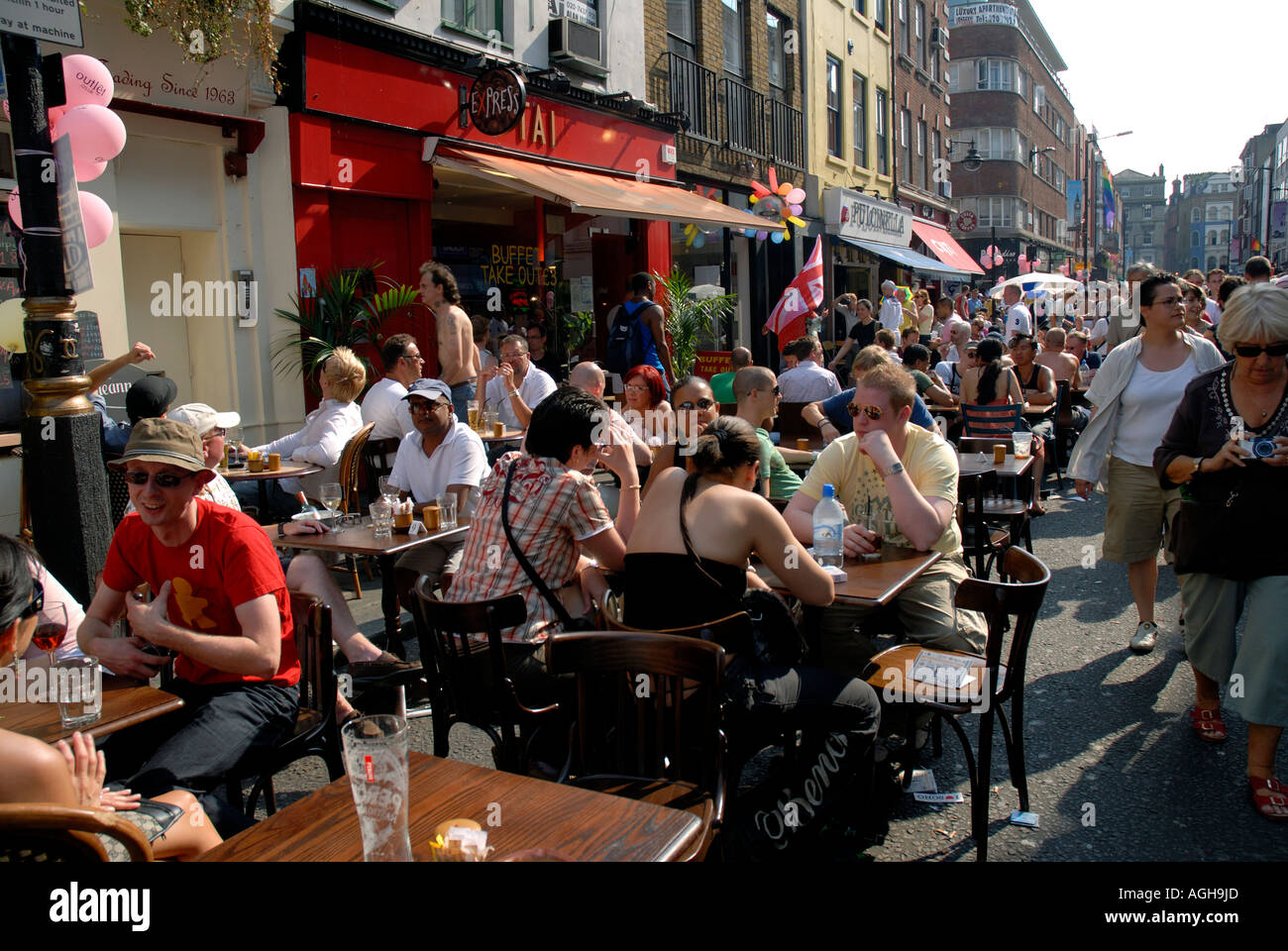 People eating and dining in Old Compton Street in Soho Central London ...