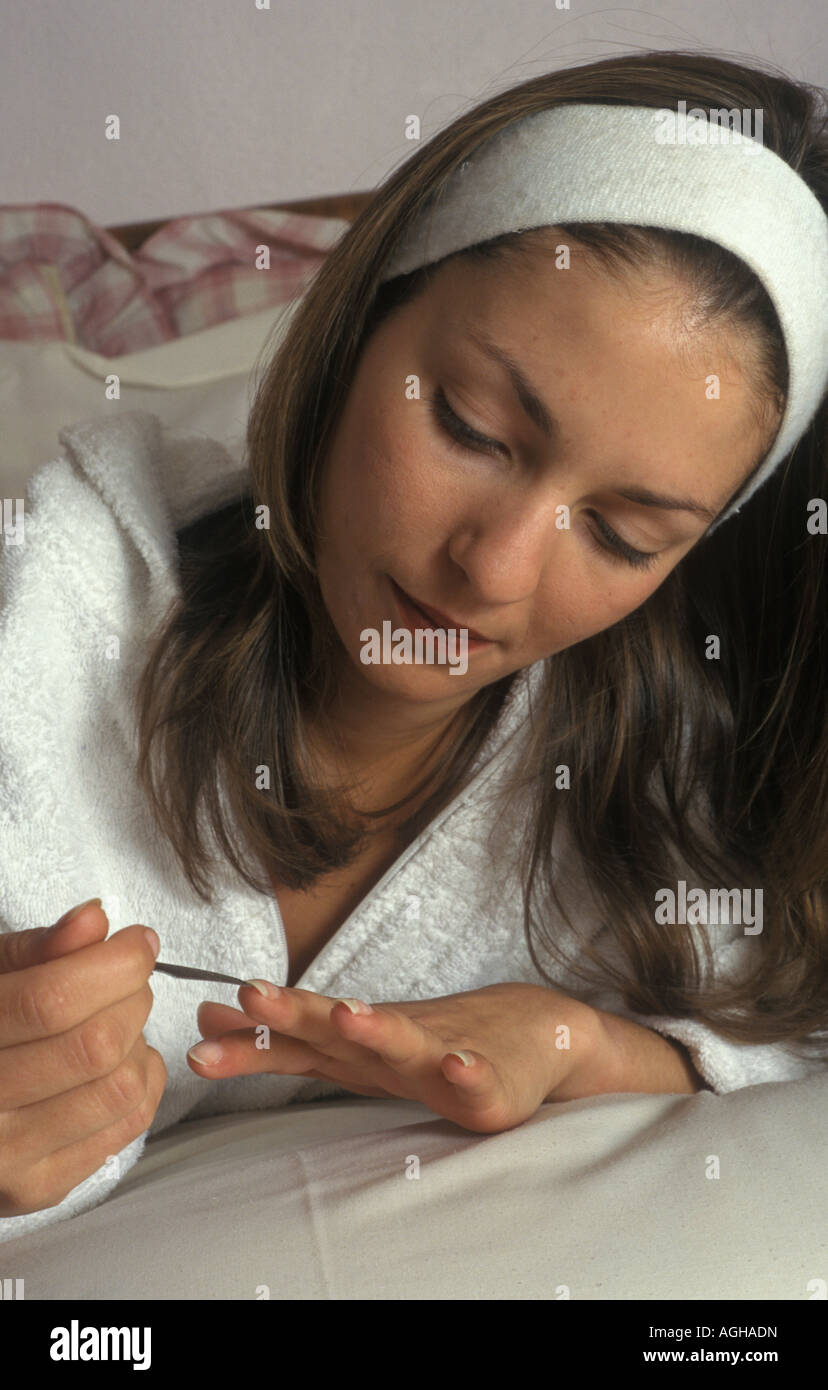 teenage girl filing her nails Stock Photo - Alamy
