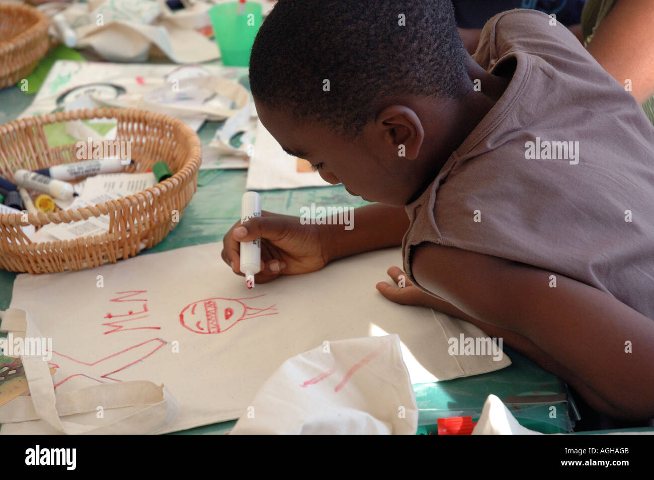 Child drawing poster at craft class in tent at Lambeth Country Fair in ...