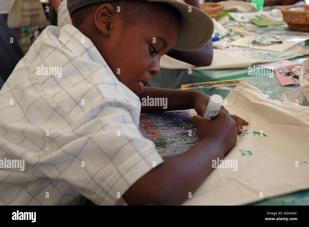 Child drawing poster at craft class in tent at Lambeth Country Fair in ...