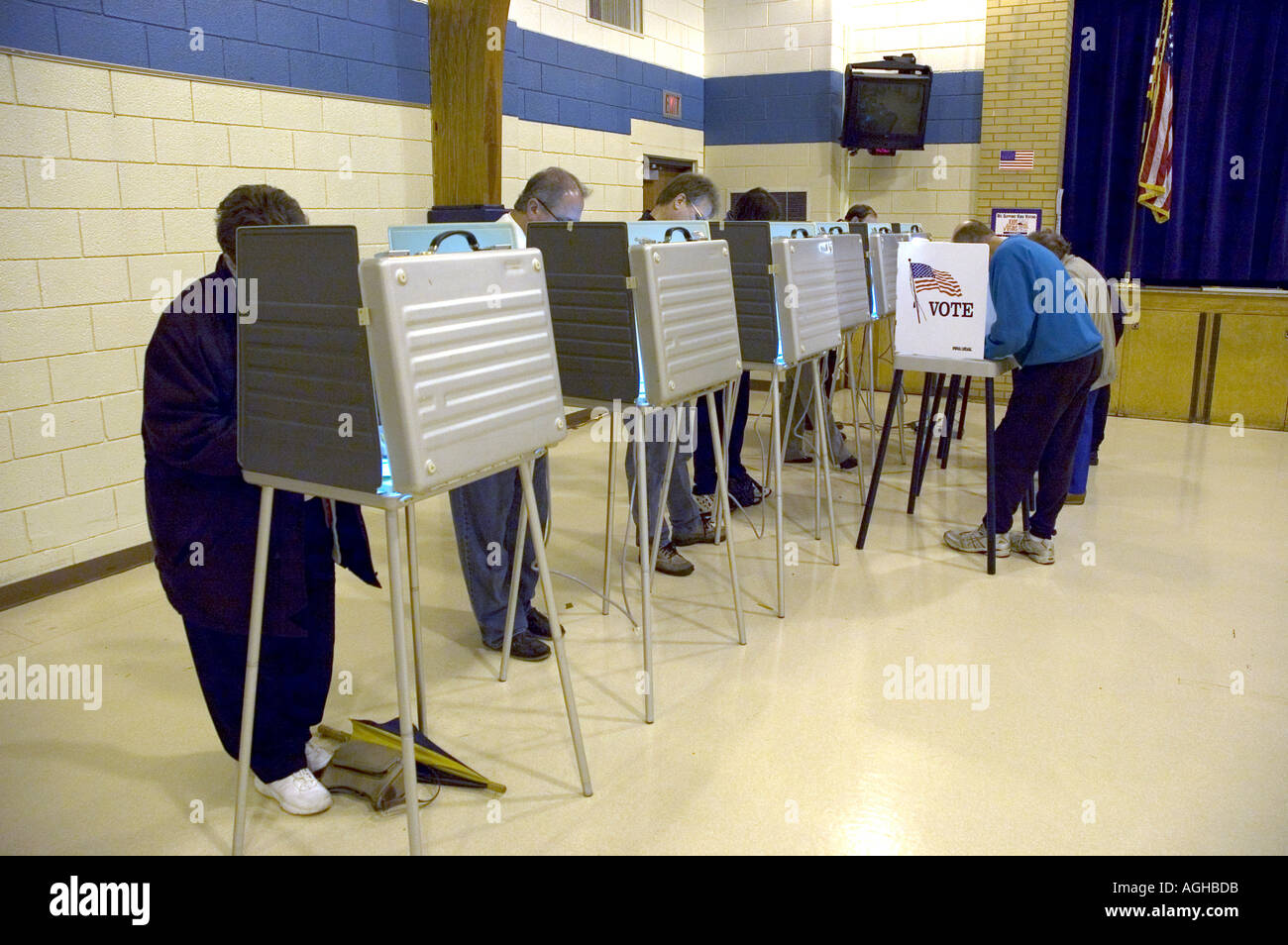 Citizens exercise their right to vote by casting ballots in voting ...
