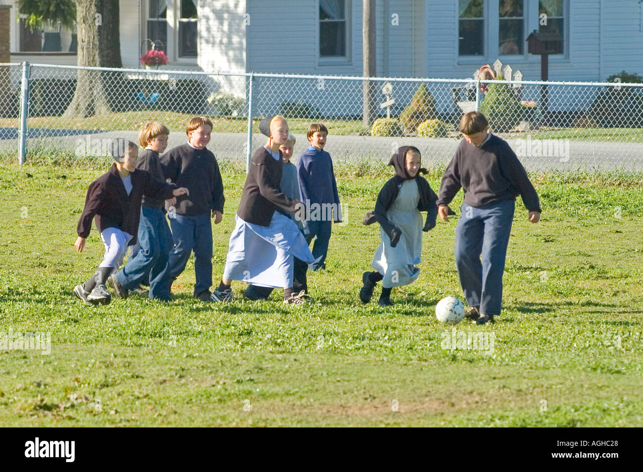 Children play school yard soccer at recess Amish life in Millersburg ...