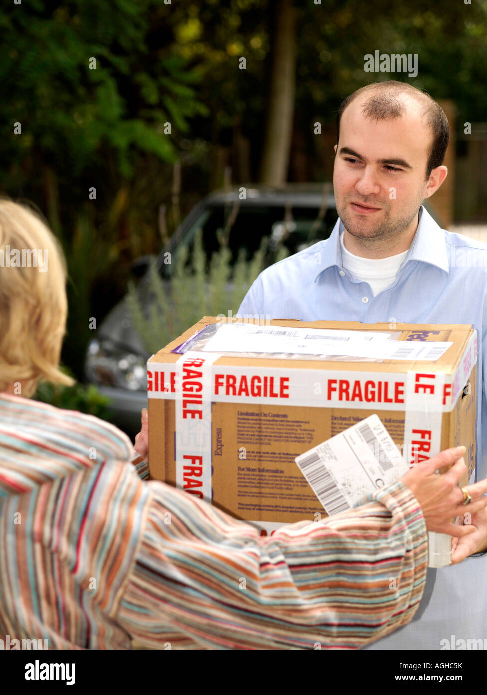 Delivery Courier Postman Model Released Stock Photo - Alamy