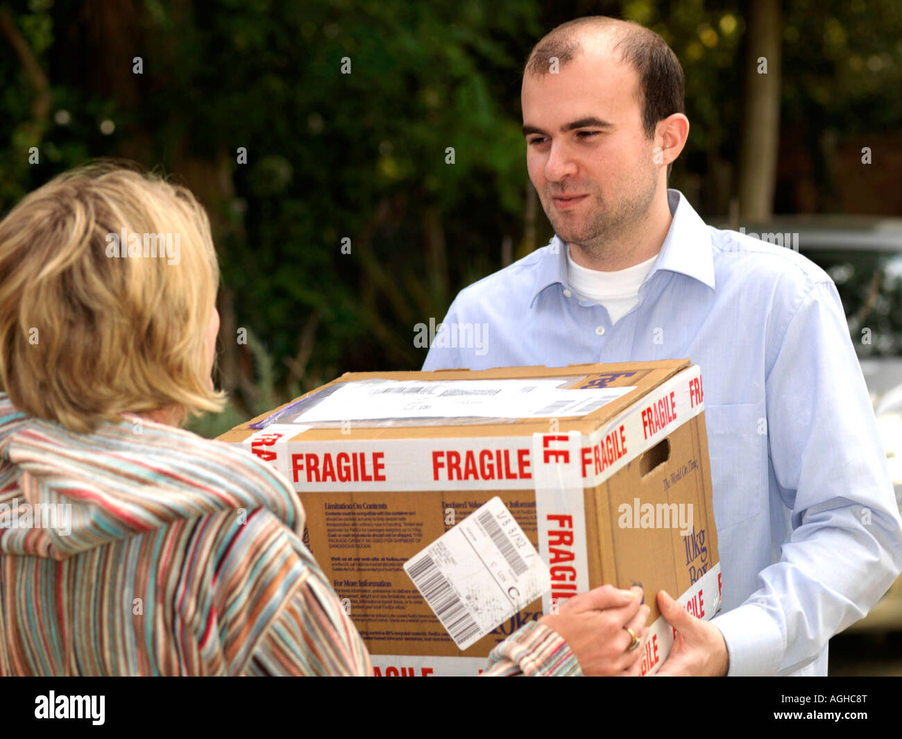 Delivery Courier Postman Model Released Stock Photo - Alamy
