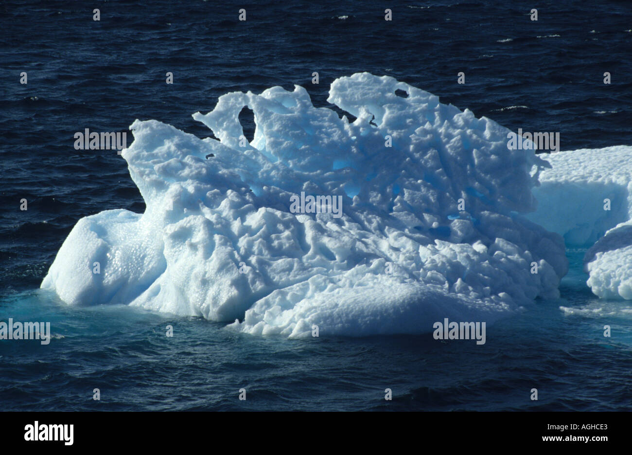 Blue iceberg eroded by waves hi-res stock photography and images - Alamy