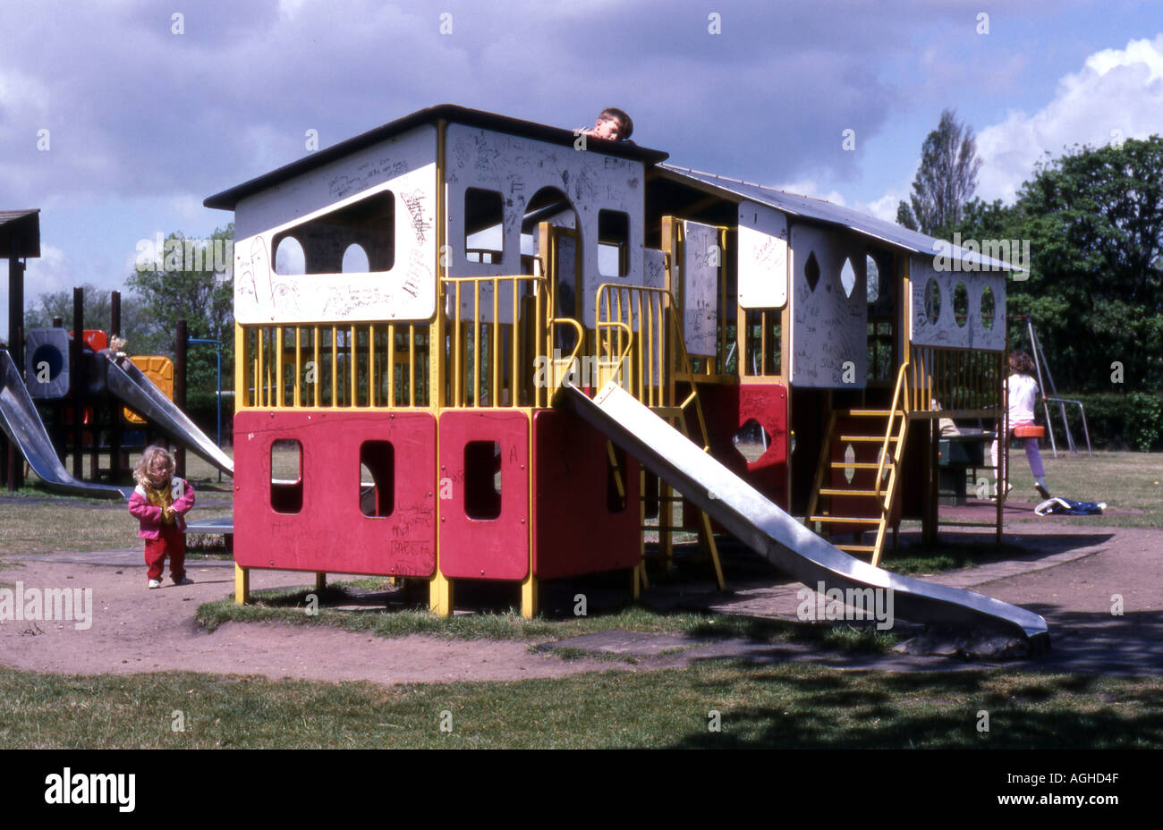 Children playing in playground house Stock Photo - Alamy
